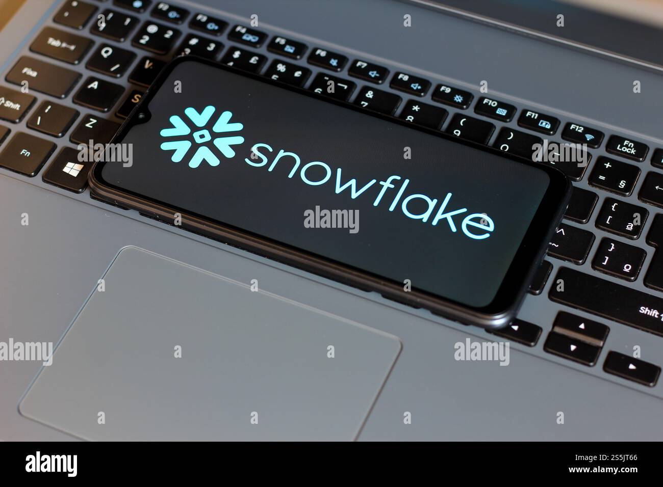 In this photo illustration, the Snowflake, Inc. logo is seen displayed ...