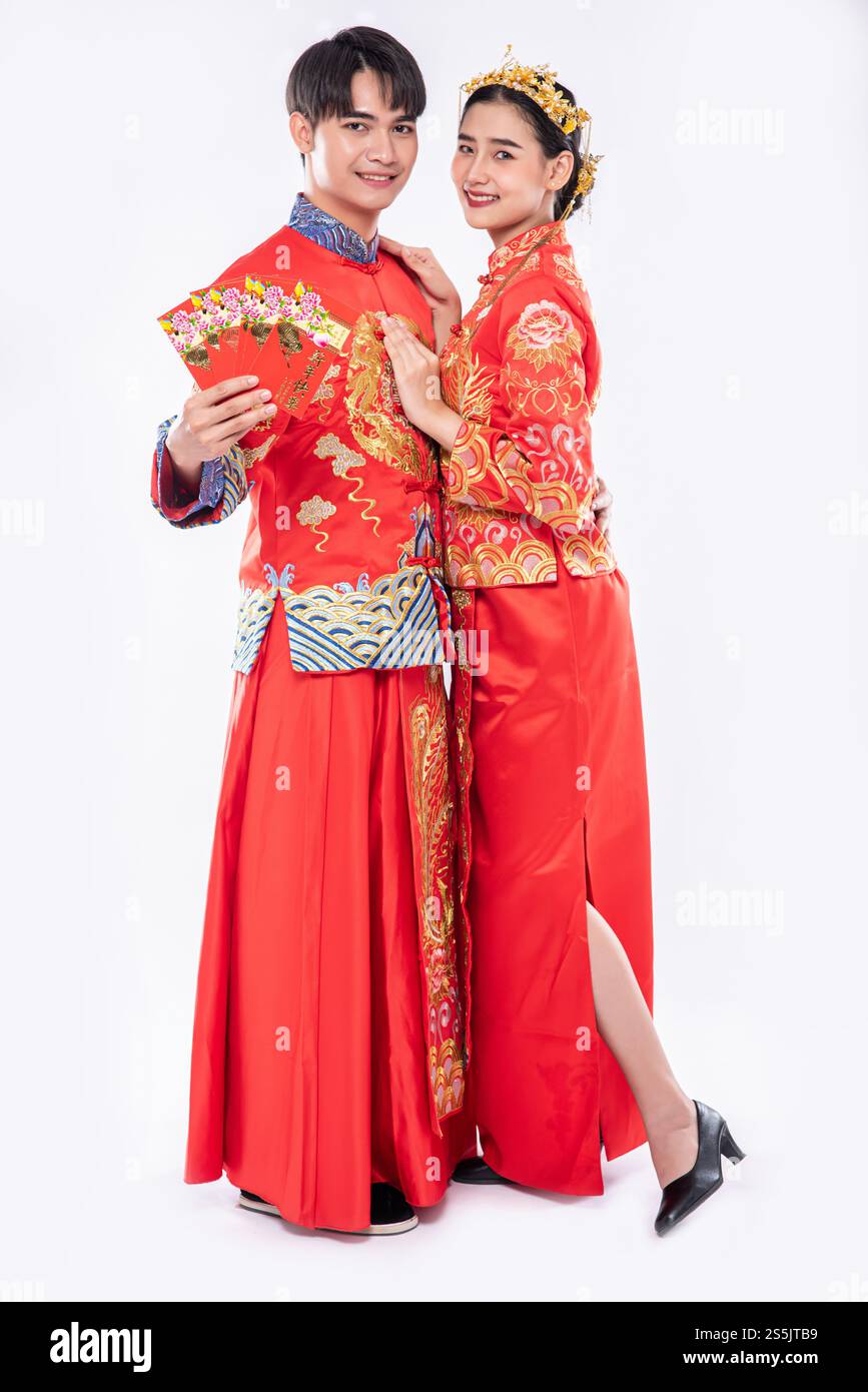 The man and woman wear Cheongsam show their gift money and cash on ...
