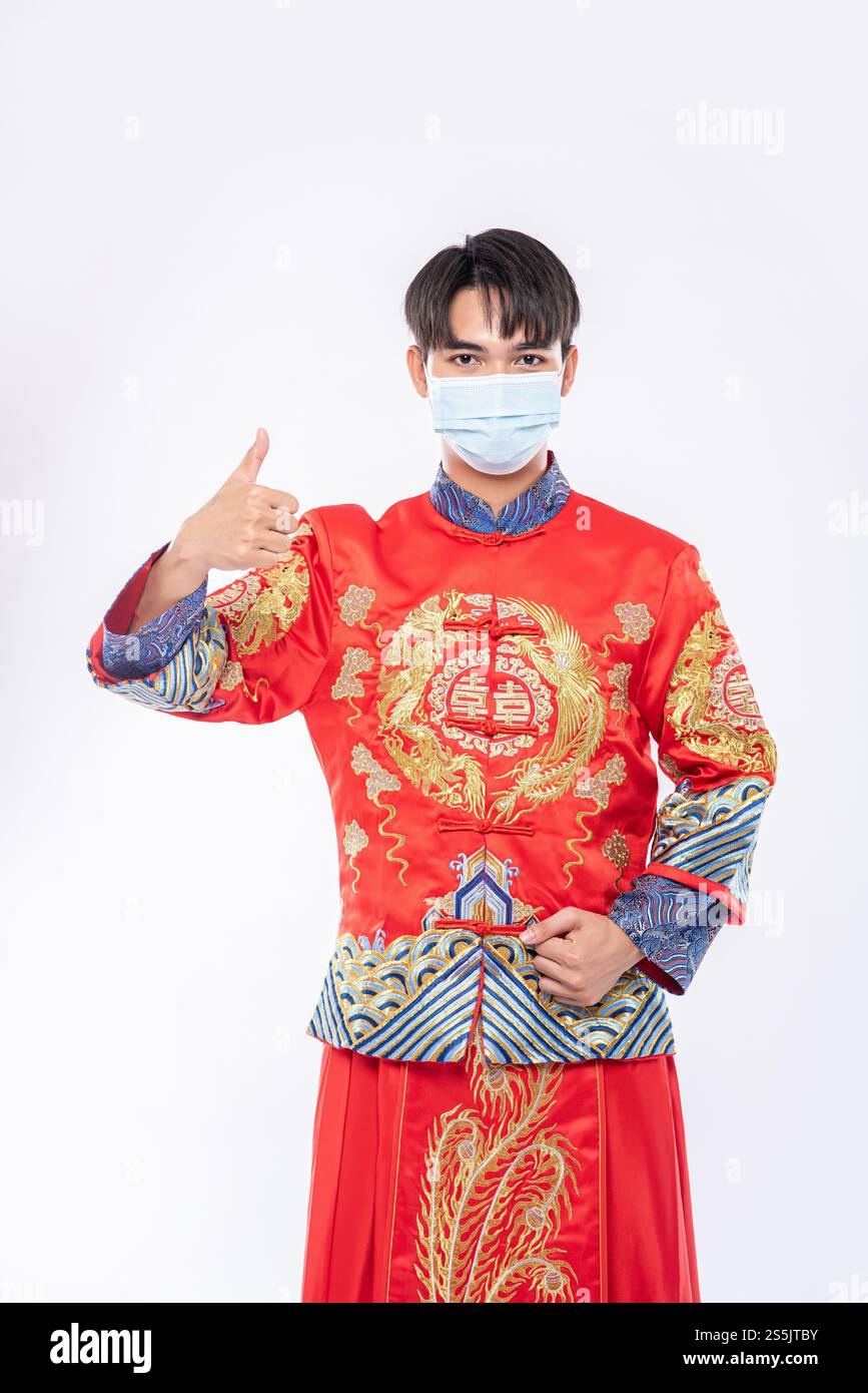 Man wear Cheongsam suit and mask show the best way to shopping for ...