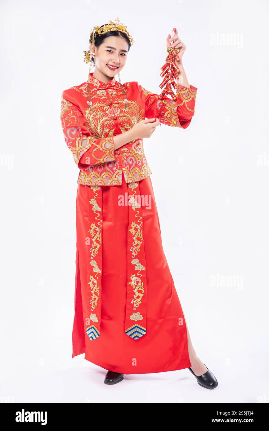 Woman wear Cheongsam suit smile to get Firecrackers from relative in ...