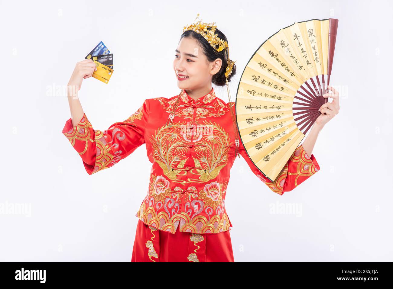 Woman wear Cheongsam suit hold the chinese hand fan show the credit ...