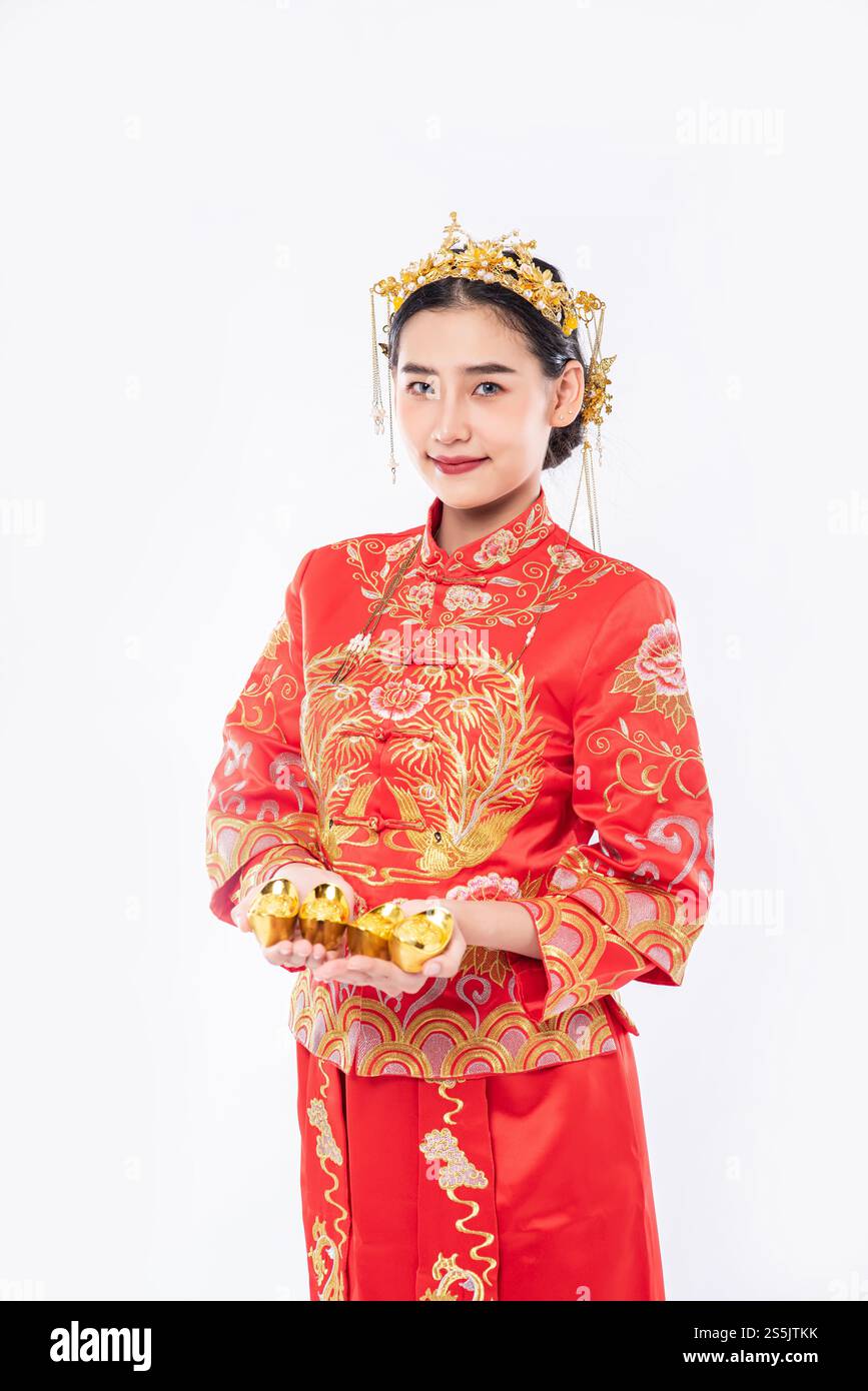 Woman wear Cheongsam suit and crown give gold to her family for lucky ...