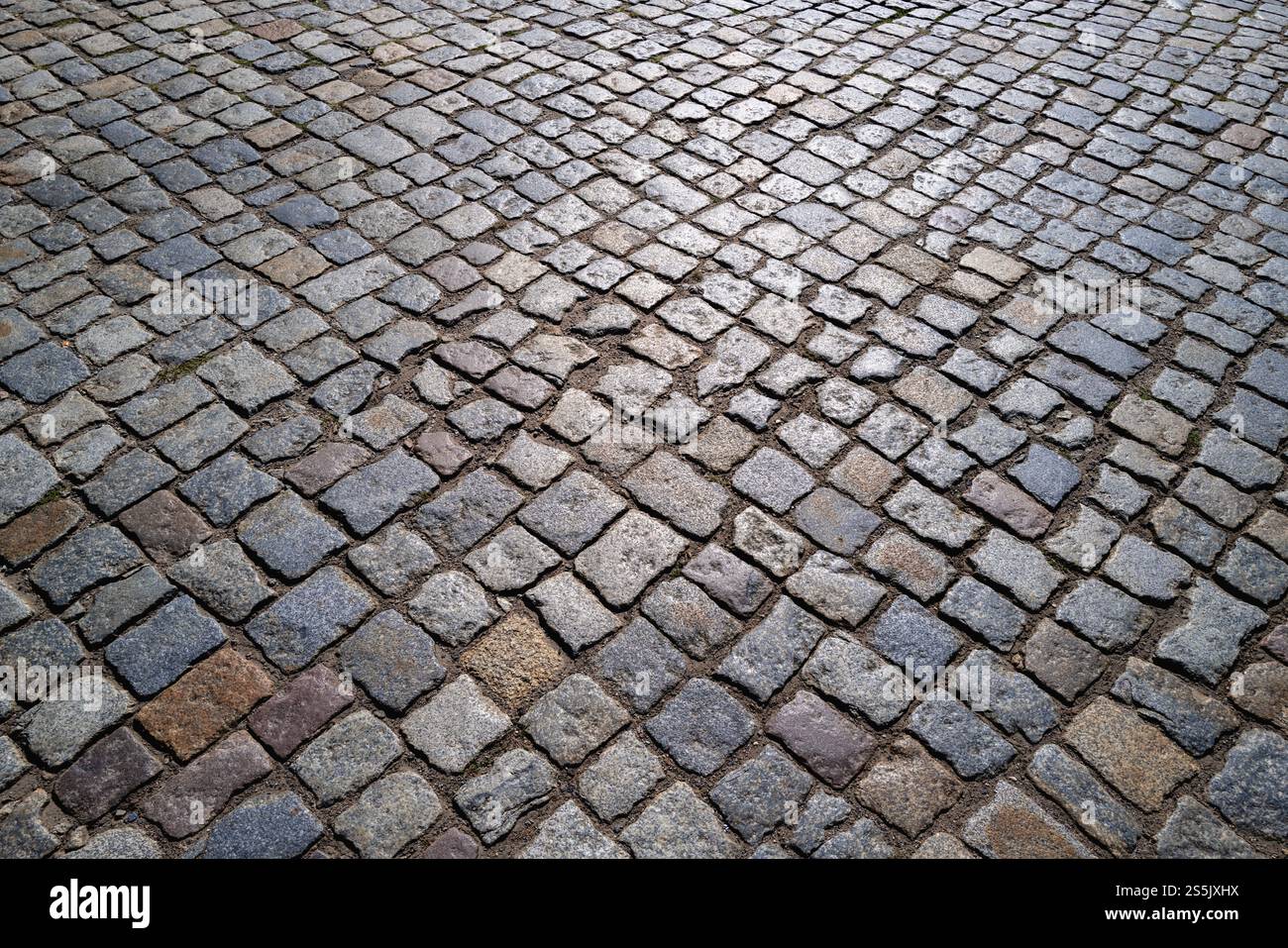 Background of bricks road. Background with bricks road. Stone cladding ...