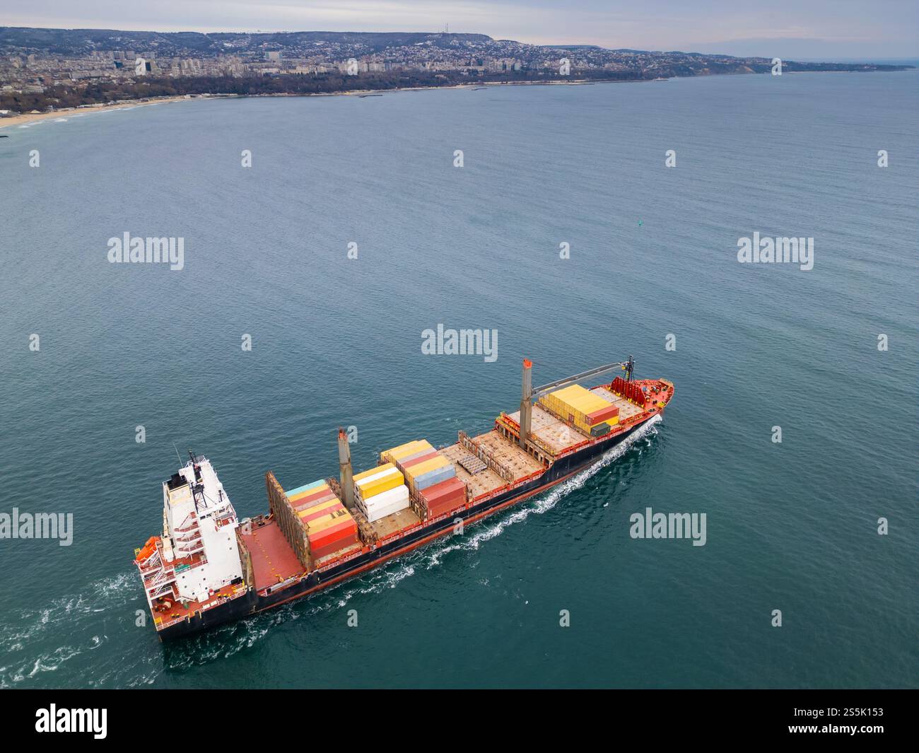 Aerial view of a cargo ship entering the port of Varna, Bulgaria. The ...