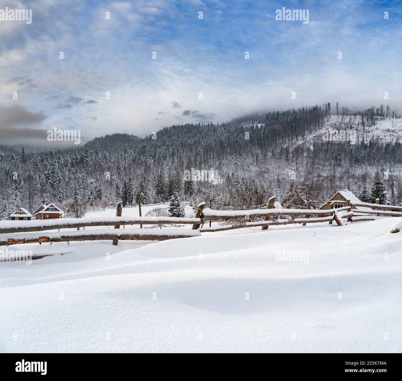 Countryside hills, groves and farmlands in winter remote alpine ...