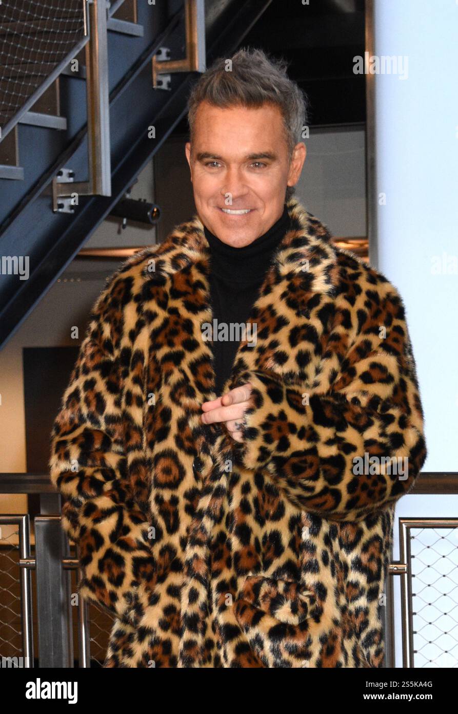 New York, NY, USA. 14th Jan, 2025. Robbie Williams visits the Empire ...