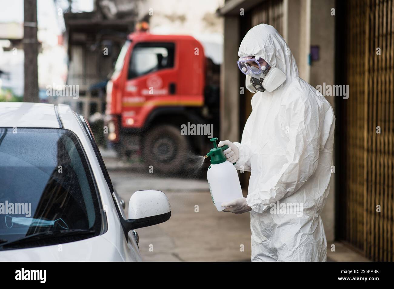 Disinfection specialist man wearing personal protective equipment (ppe ...