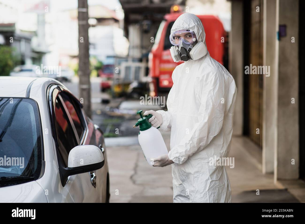 Disinfection specialist man wearing personal protective equipment (ppe ...