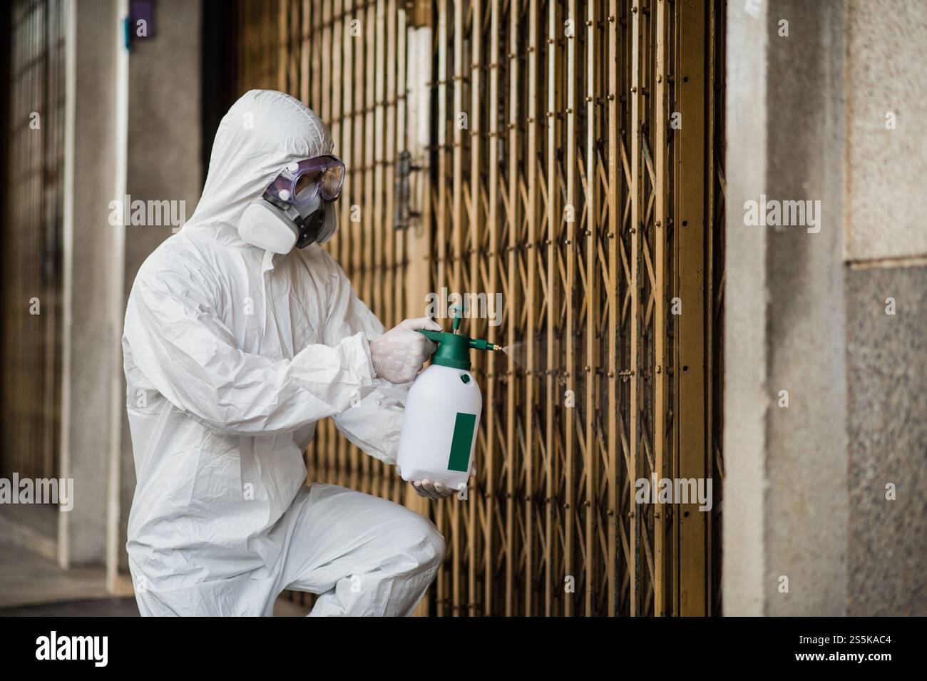Disinfection specialist man wearing personal protective equipment (ppe ...