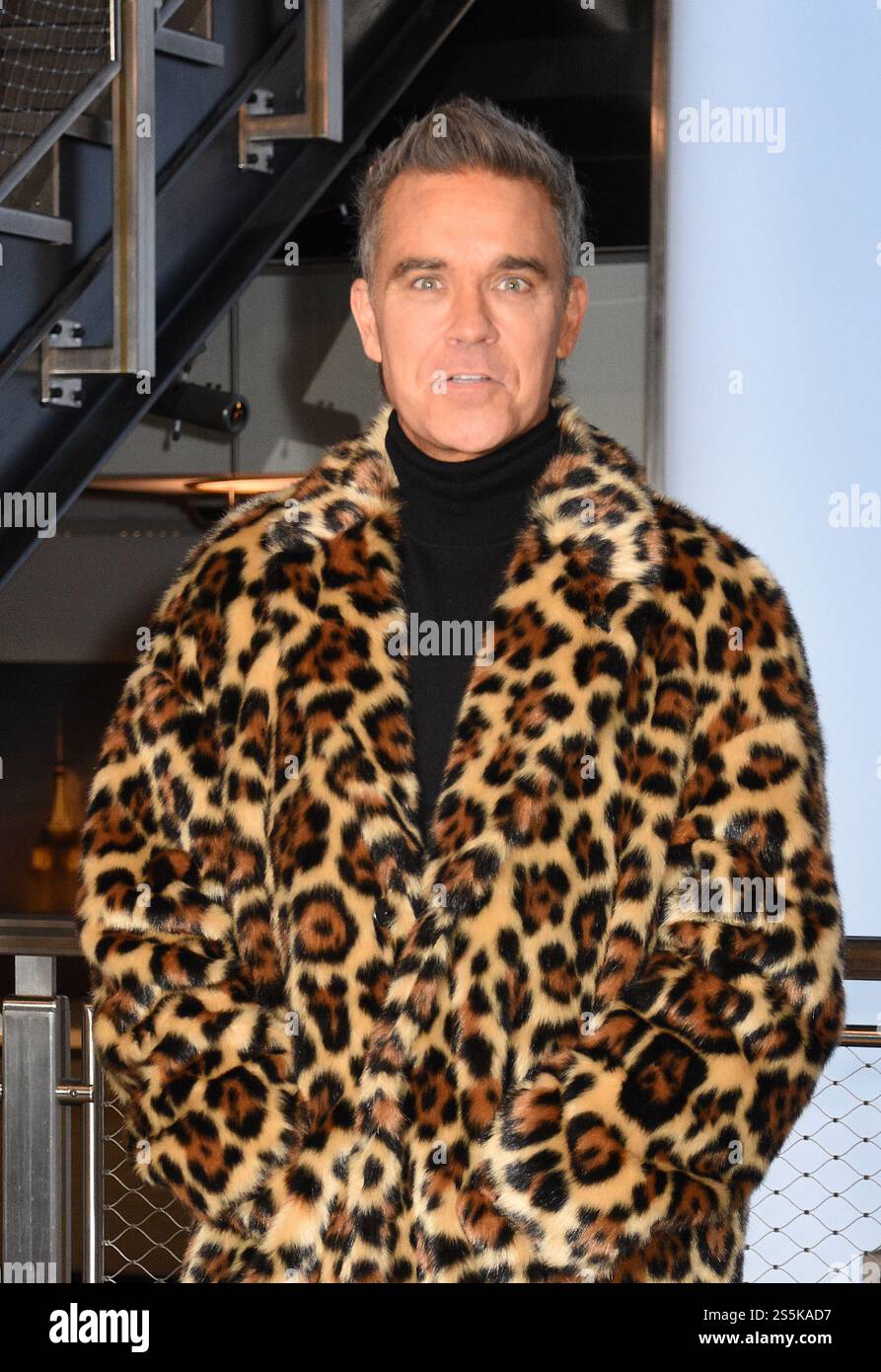 New York, NY, USA. 14th Jan, 2025. Robbie Williams visits the Empire ...