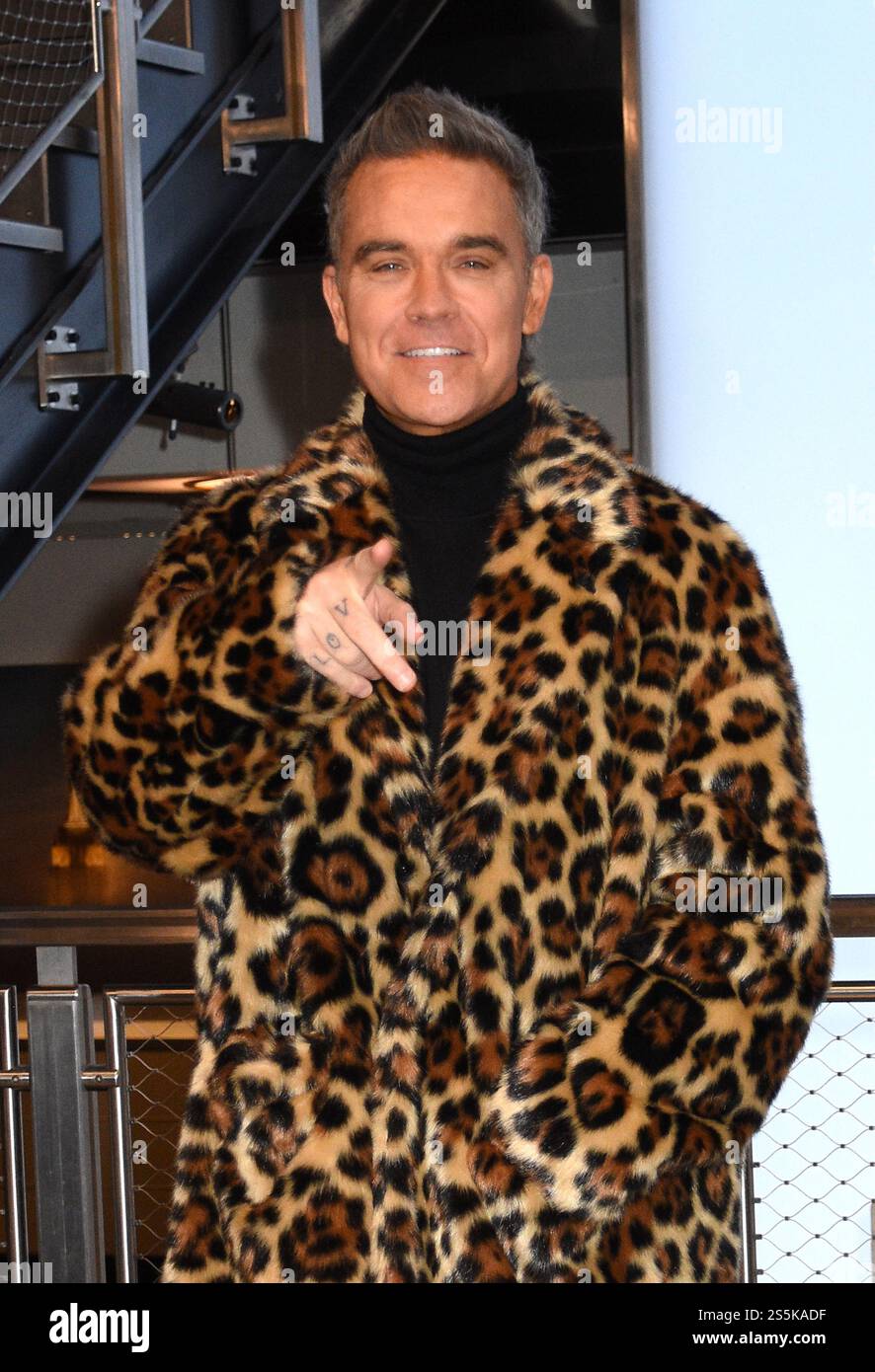 New York, NY, USA. 14th Jan, 2025. Robbie Williams visits the Empire ...