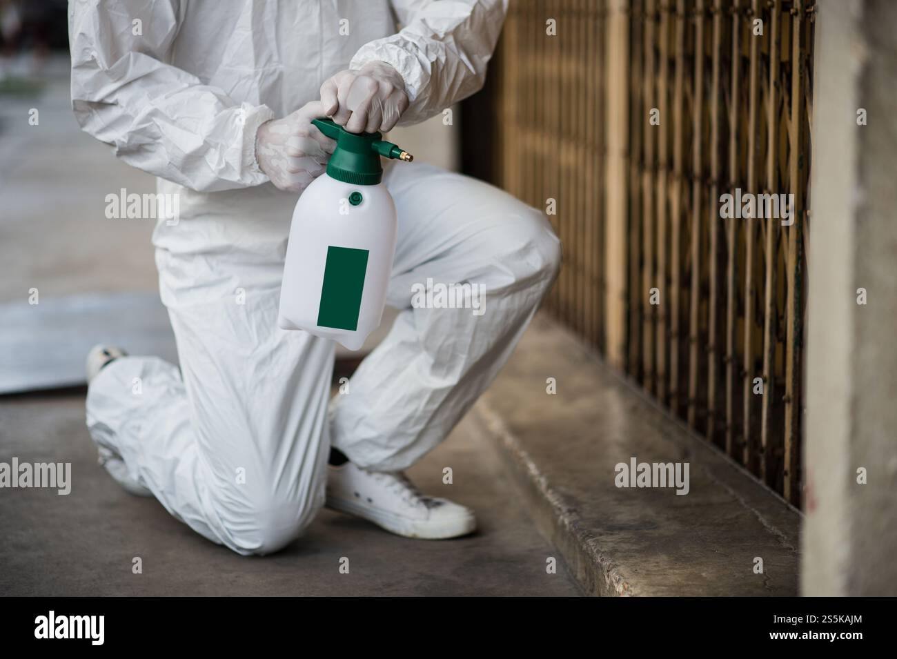 Hand of Disinfection specialist wearing personal protective equipment ...