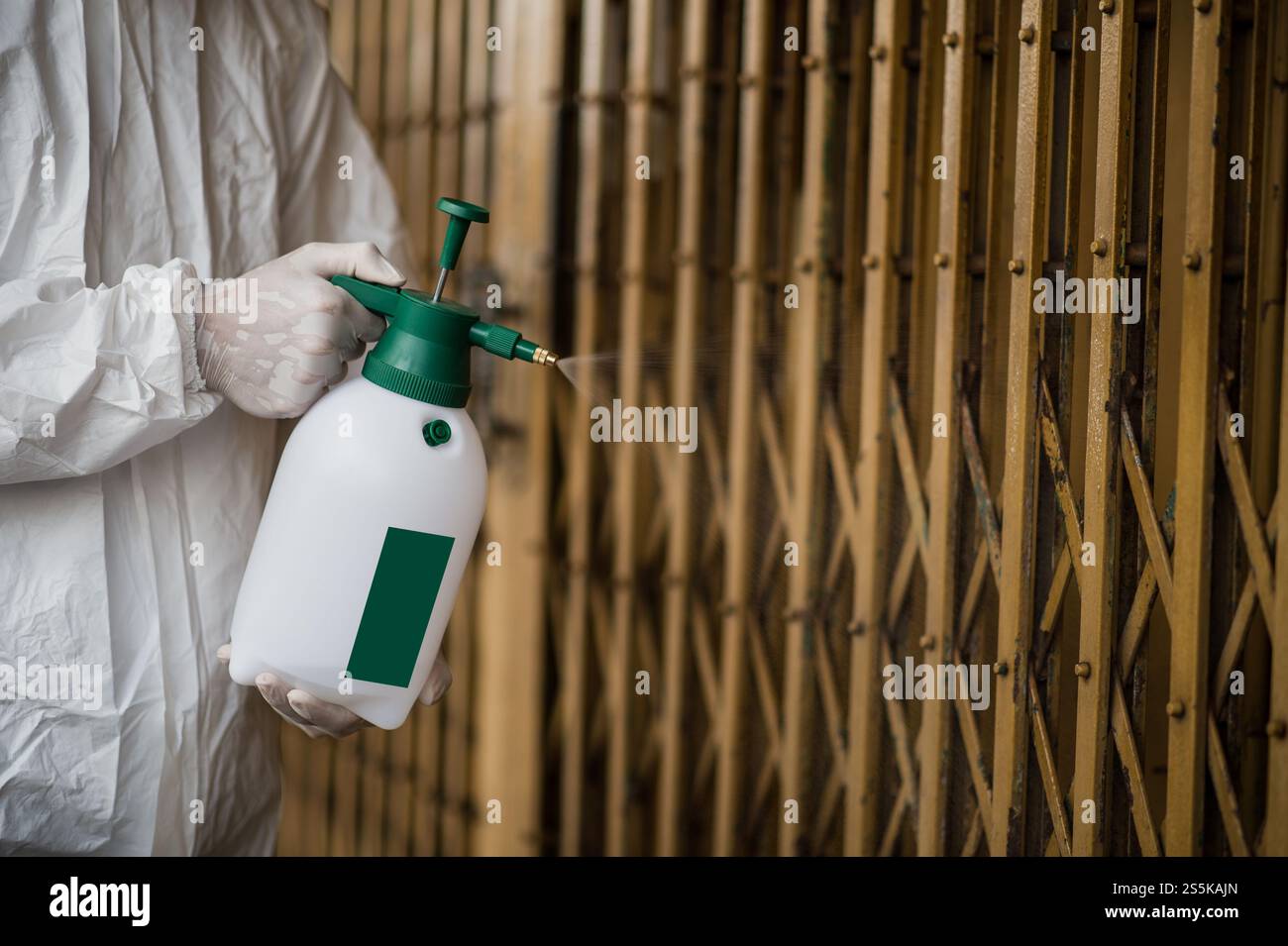 Hand of Disinfection specialist man wearing personal protective ...