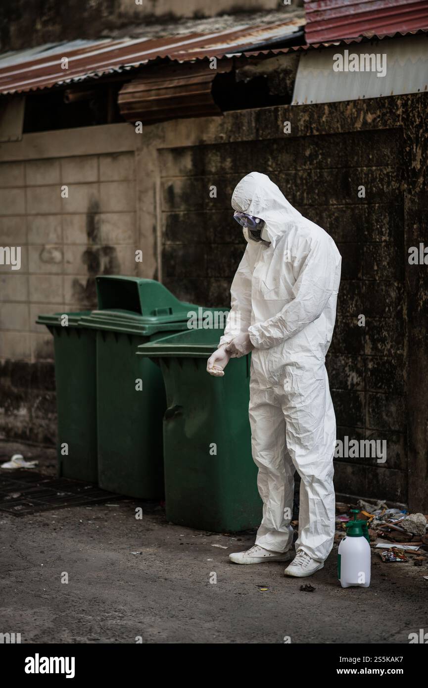 Man in personal protective equipment ppe suit wearing clear glasses and ...