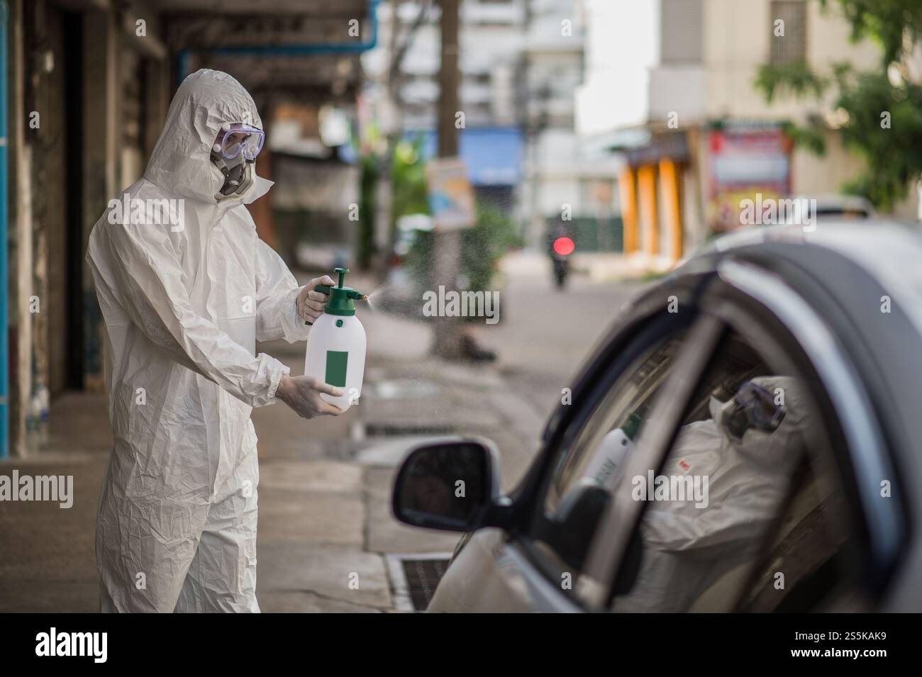 Disinfection specialist man in personal protective equipment ppe suit ...