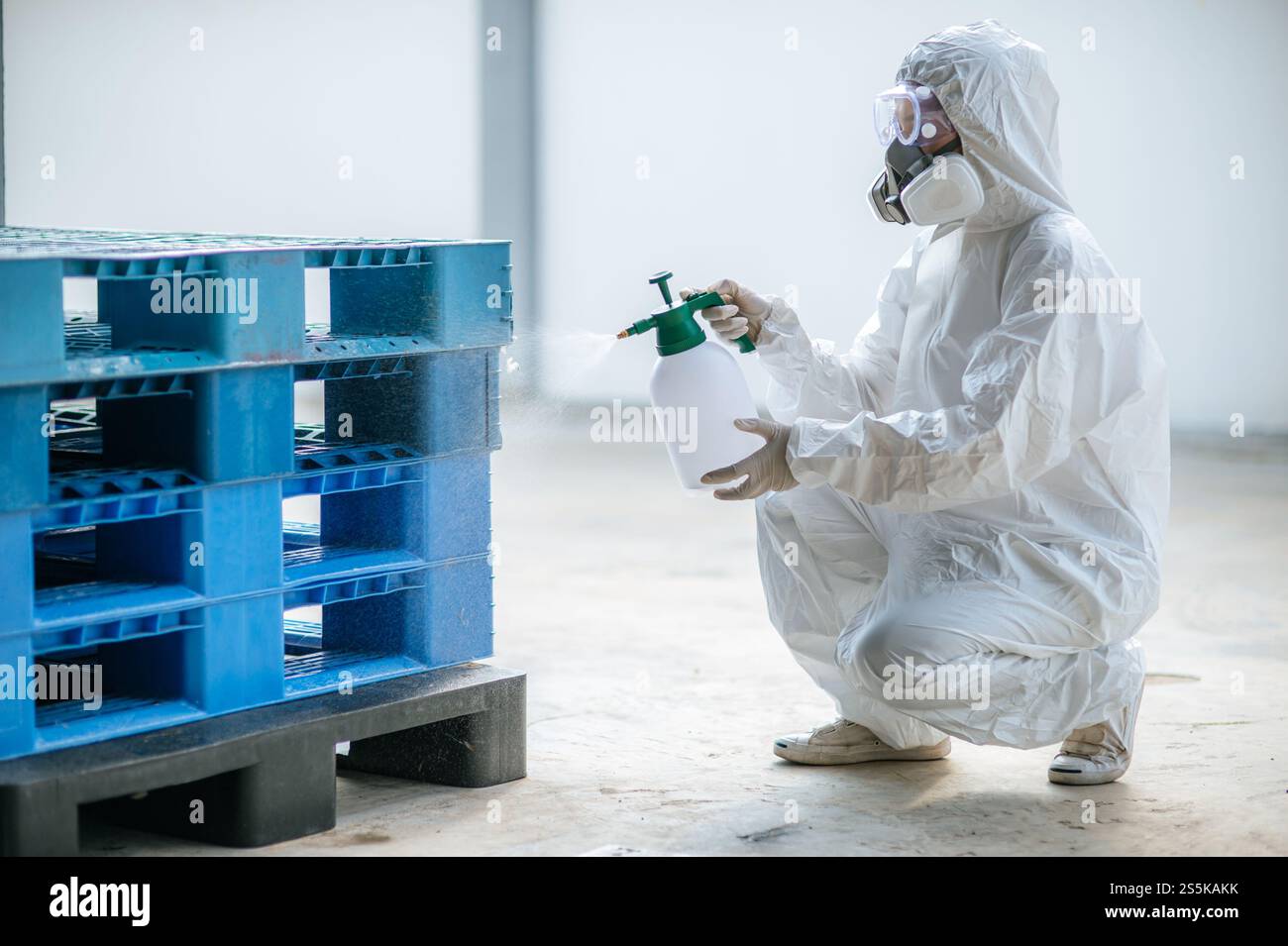 Disinfection specialist woman in personal protective equipment (ppe ...