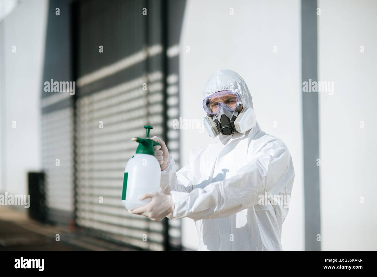 Disinfection specialist staff in personal protective equipment (ppe ...