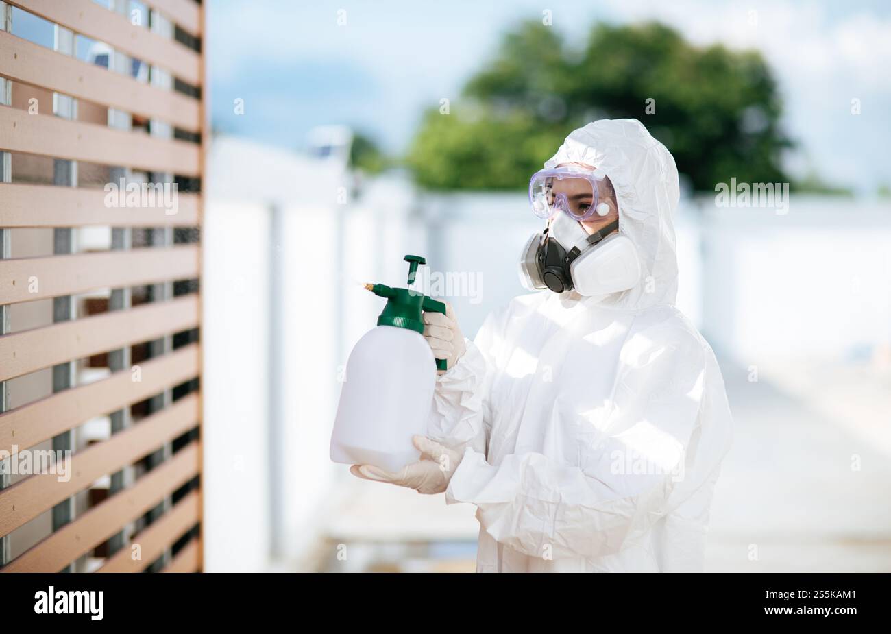 Disinfection specialist woman in personal protective equipment (ppe ...