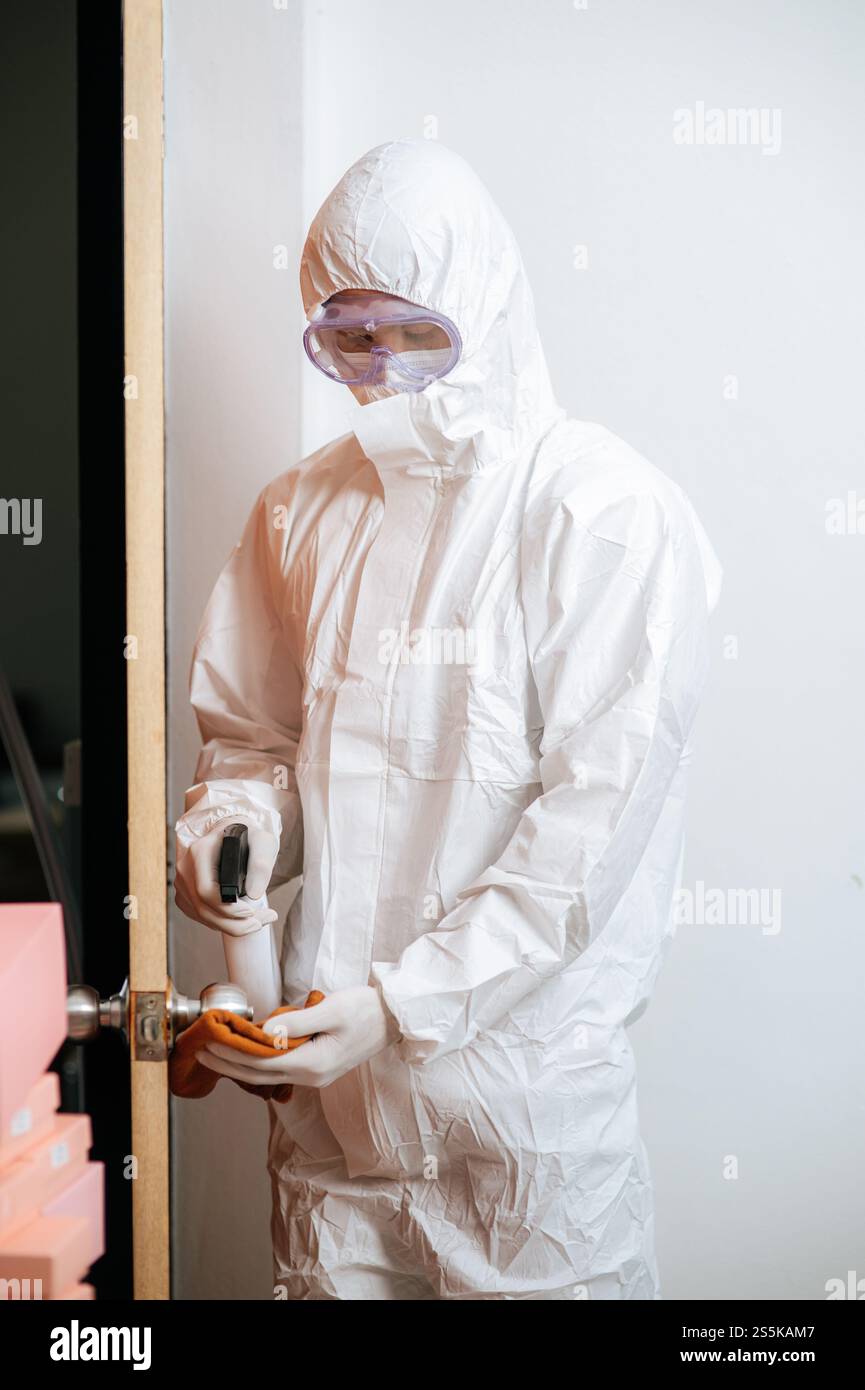 Disinfection specialist staff in personal protective equipment (ppe ...