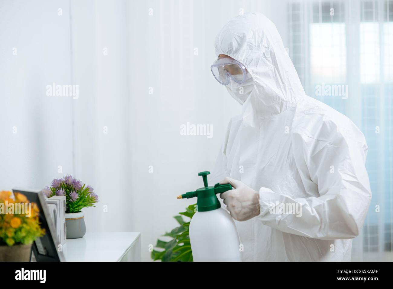 Disinfection specialist staff in personal protective equipment (ppe ...