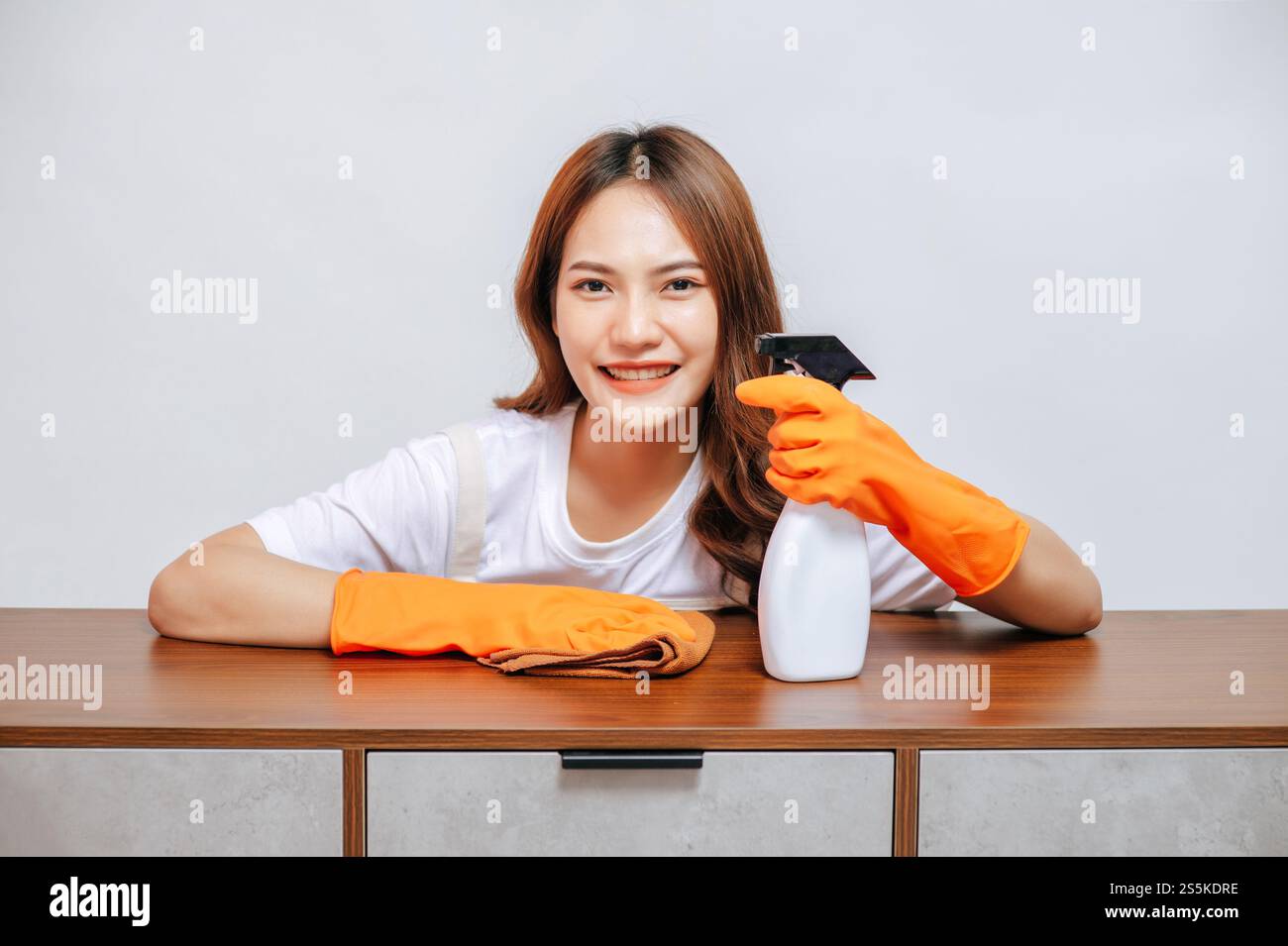 Portrait Asian young pretty woman was spray disinfectant bottle and ...