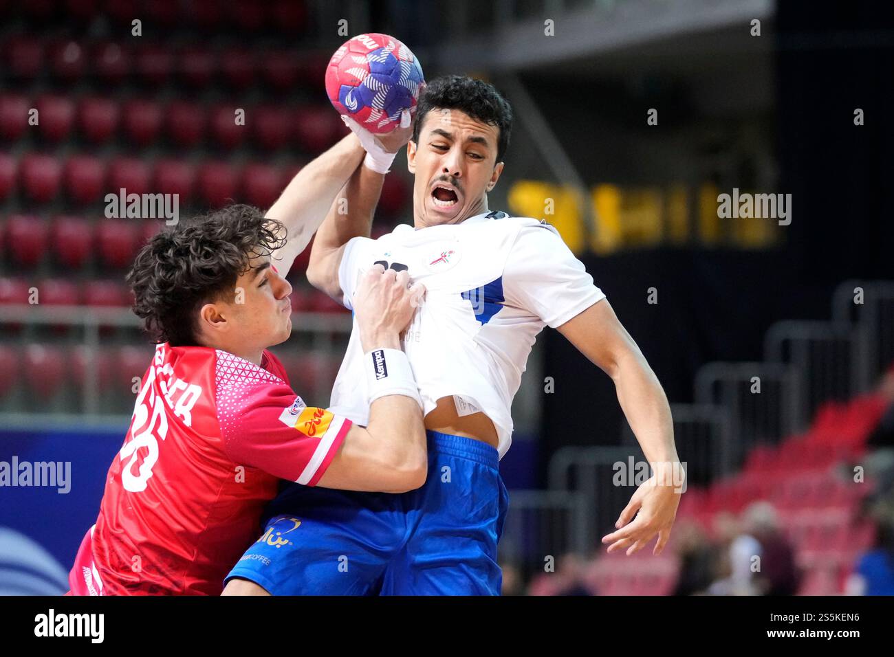 Austria's Elias Kofler, left, tries to block a shot of Kuwait's Saif ...