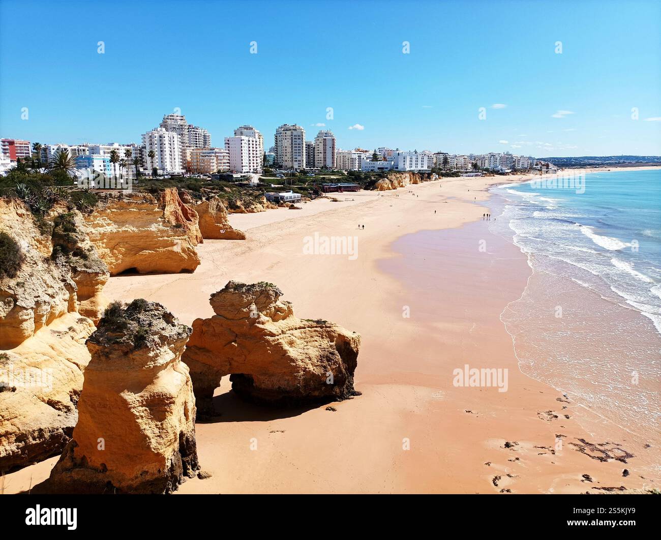 Beautiful Portugal beach with a view of the city of Pera Stock Photo ...