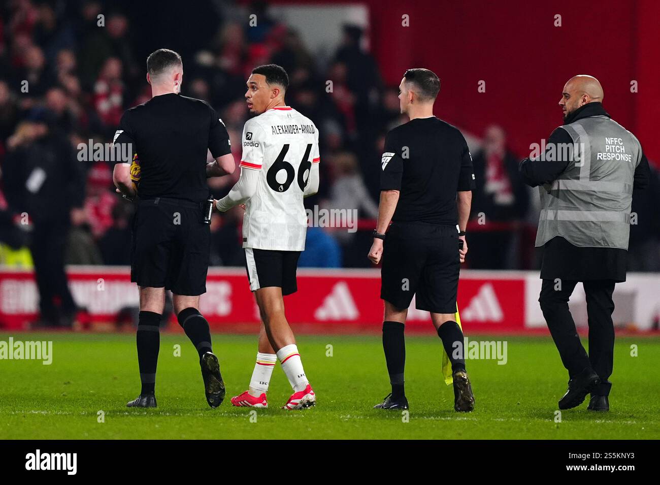 Liverpool's Trent Alexander-Arnold with referee Chris Kavanagh during ...