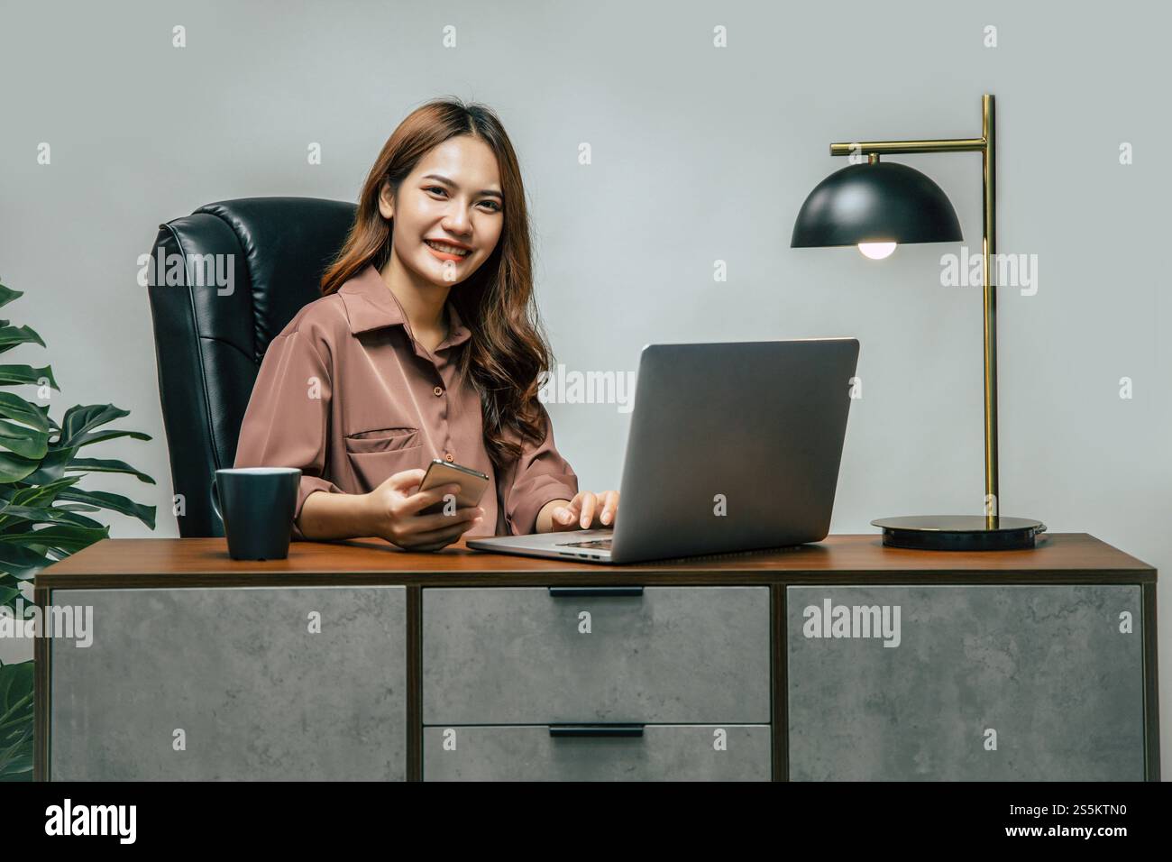 Happily Young asian woman with new normal, she Stay at home and works ...