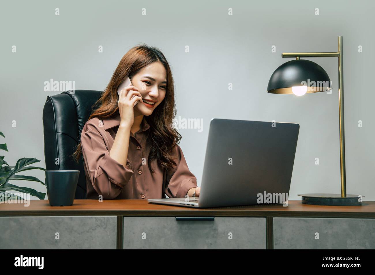 Happily Young asian woman with new normal, she Stay at home and works ...