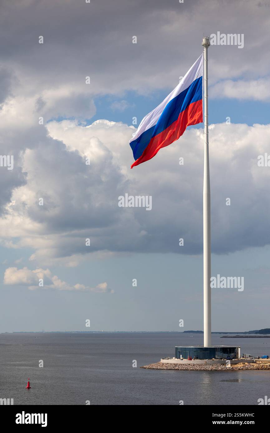 Flag of Russian Federation is flying in air on blue sky and white ...