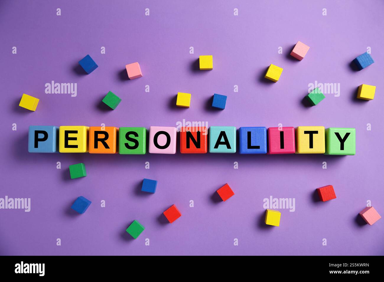 Word Personality made of colorful cubes with letters on purple ...