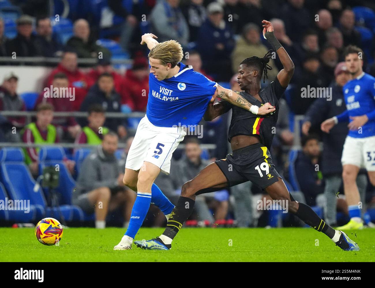 Cardiff City's Jesper Daland (left) and Watford's Vakoun Issouf Bayo ...