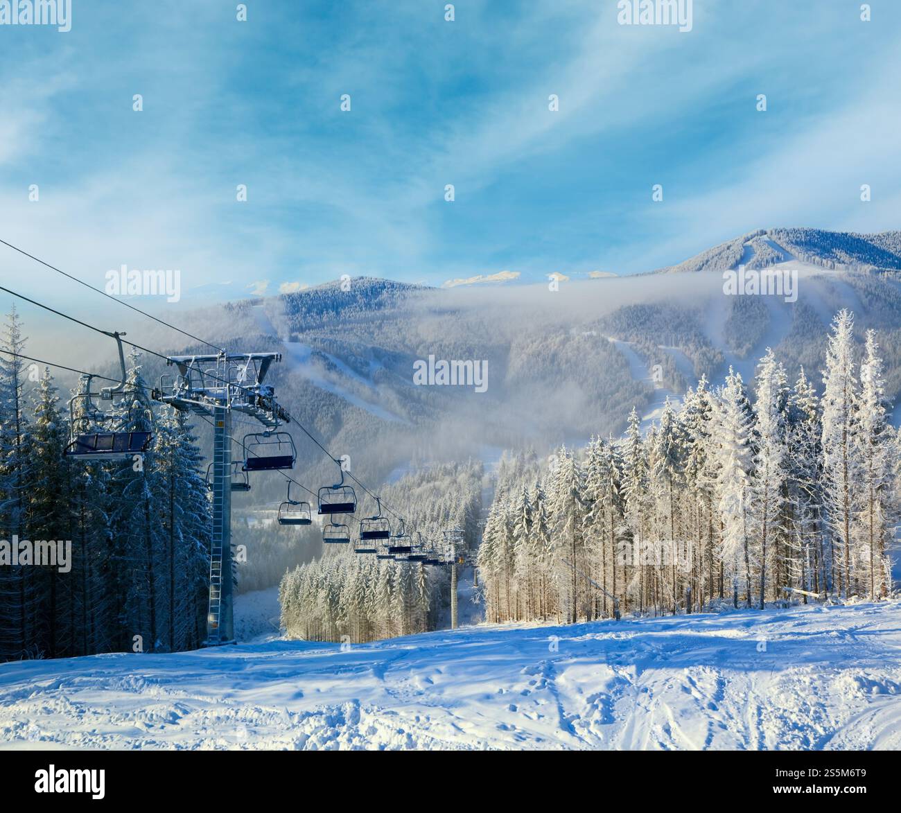 winter mountain landscape with ski lift and skiing slope Stock Photo ...
