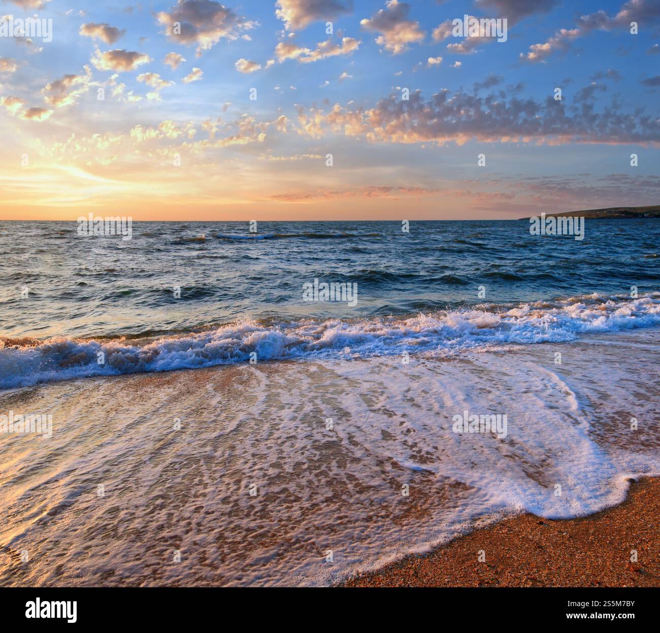 Sea surf wave break on sunset sandy coastline Stock Photo - Alamy