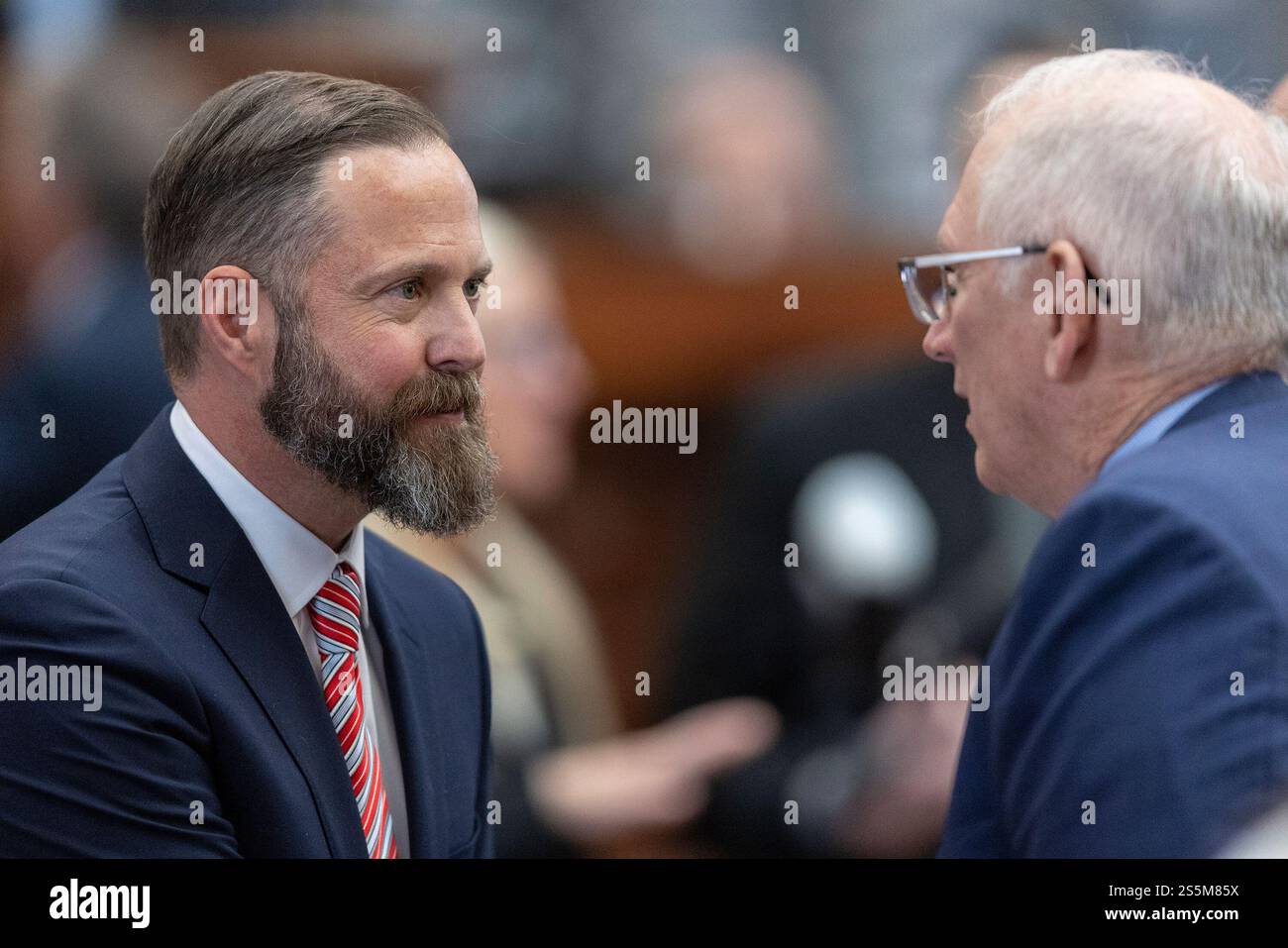 Texas state Rep. Dustin Burrows, R-Lubbock, left, speaks with Texas state Rep. Mark Dorazio, R ...
