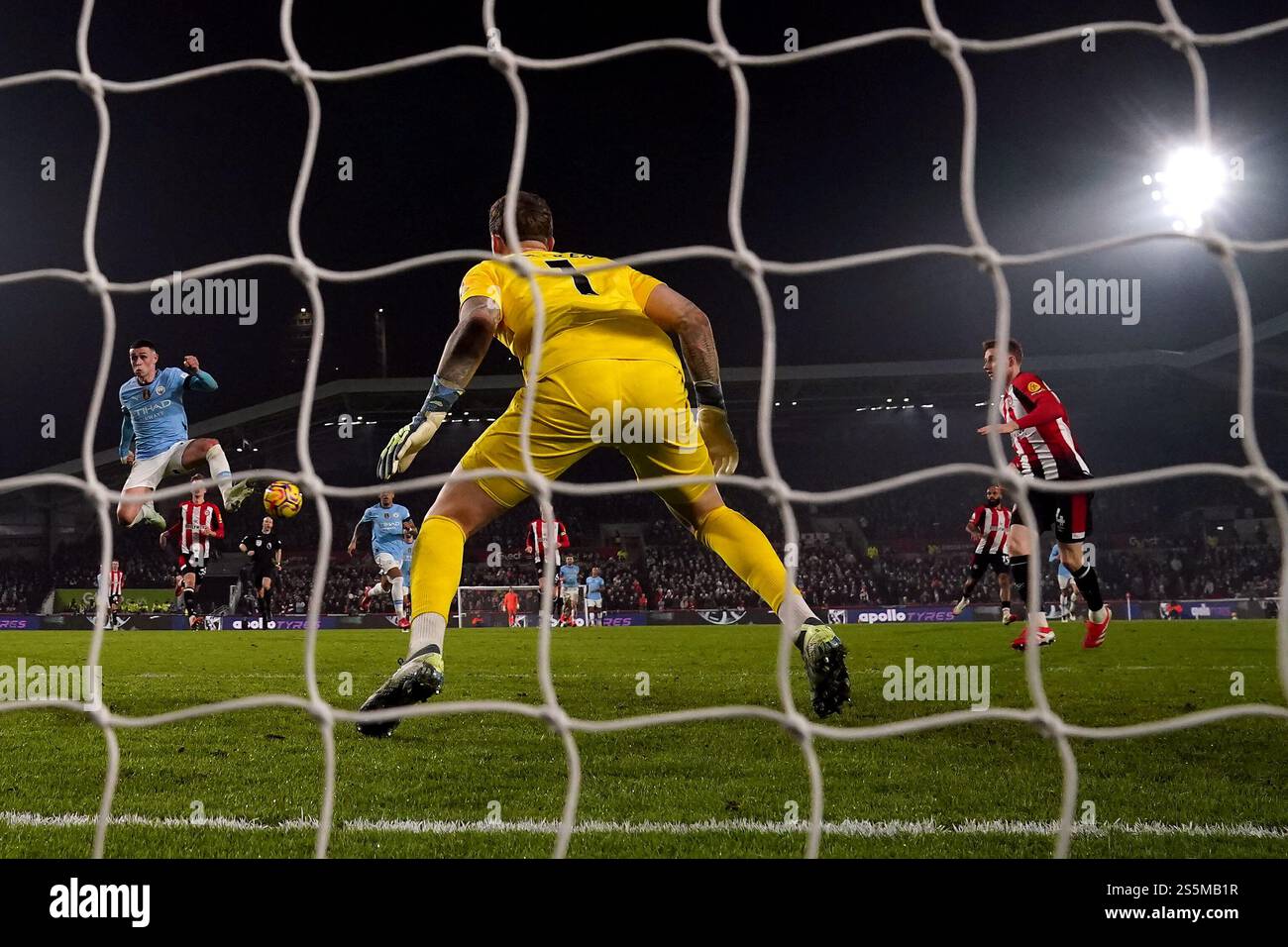 Manchester City's Phil Foden scores their side's first goal of the game ...