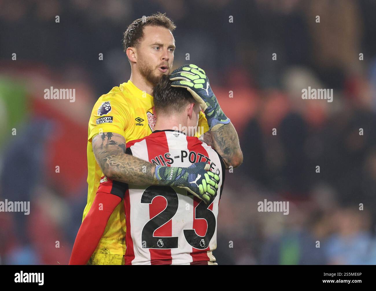 London, UK. 14th Jan, 2025. Mark Flekken (L) and Keane Lewis-Potter of ...