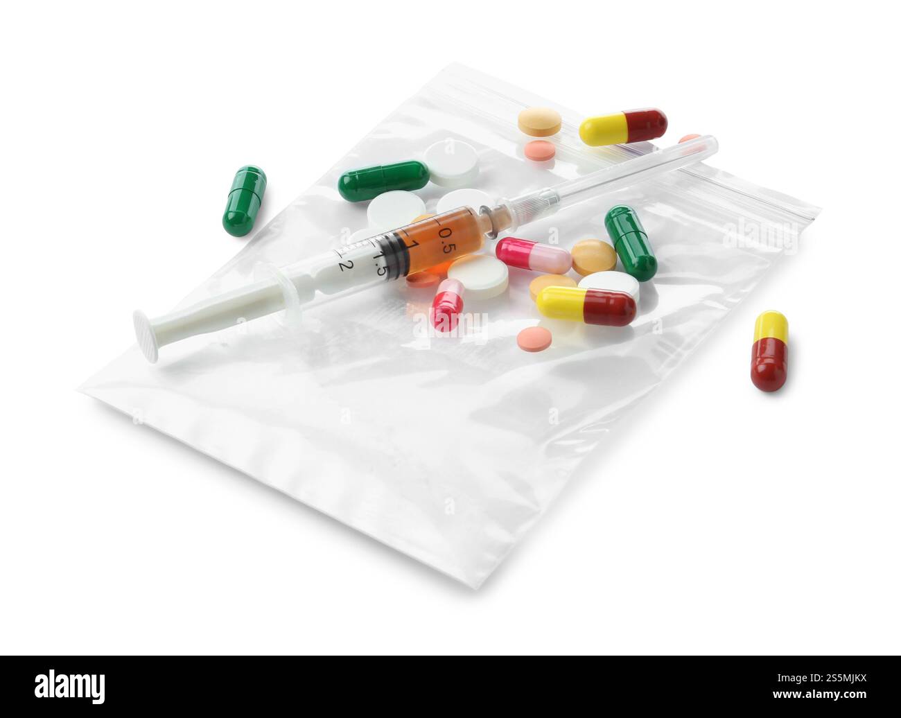 Drug addiction. Different pills, plastic bag with powder and syringe ...