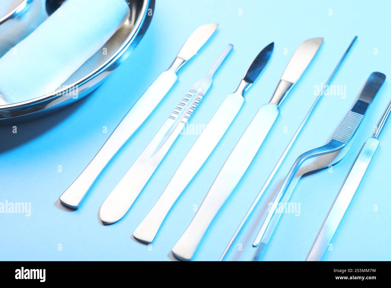 Different surgical instruments on light blue background, closeup Stock ...