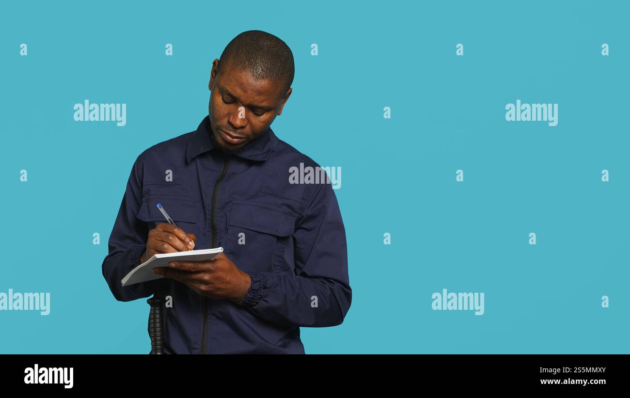 Security guard with notepad taking notes, receiving orders about ...