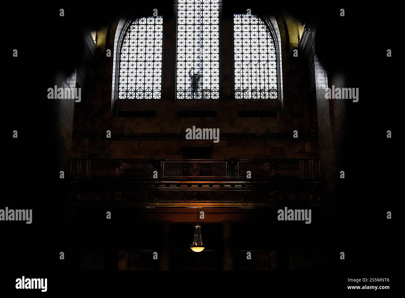 A worker opens windows on an upper level of the Washington State ...