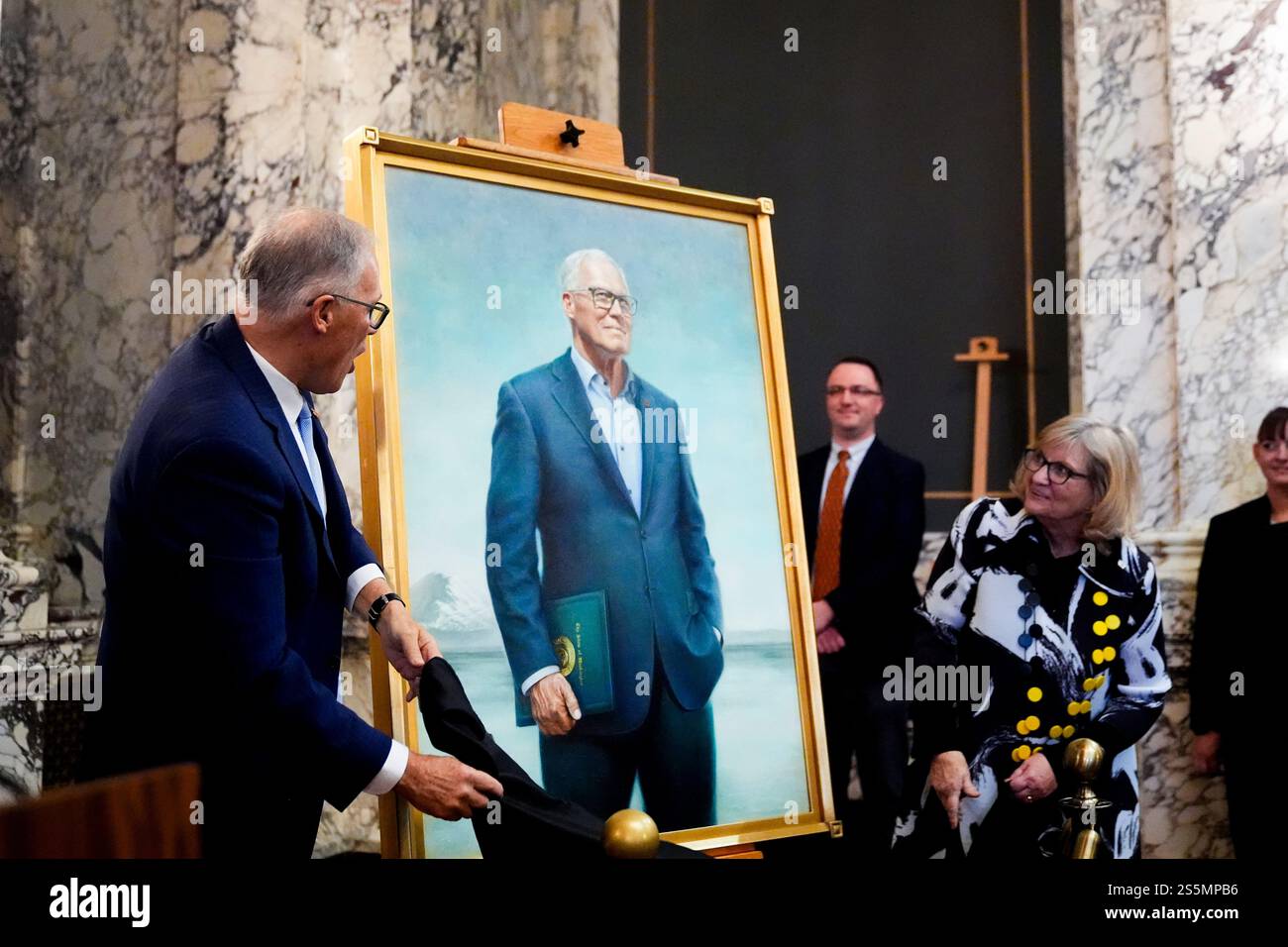 Washington Gov. Jay Inslee reacts as he unveils his official portrait ...