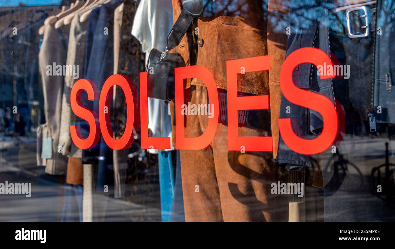 Close-up of a red "SALE" sign written in French on the window of a ...
