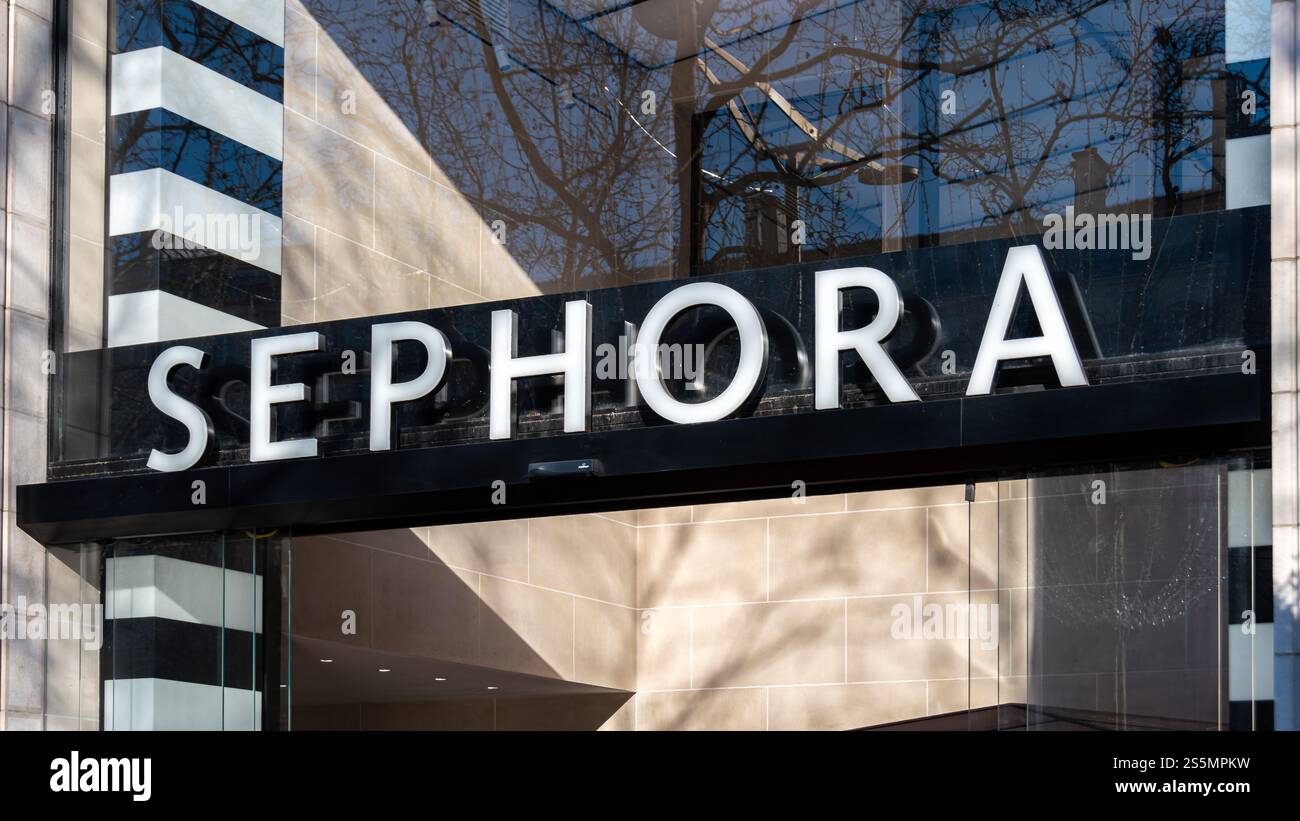 Sign and logo at the entrance to a Sephora boutique. Sephora is a ...