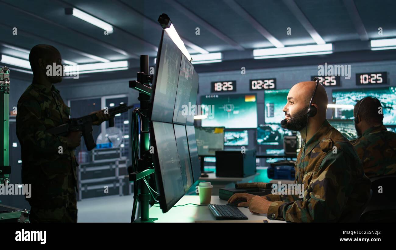 Military dispatcher using headphones microphone, offering info to ...