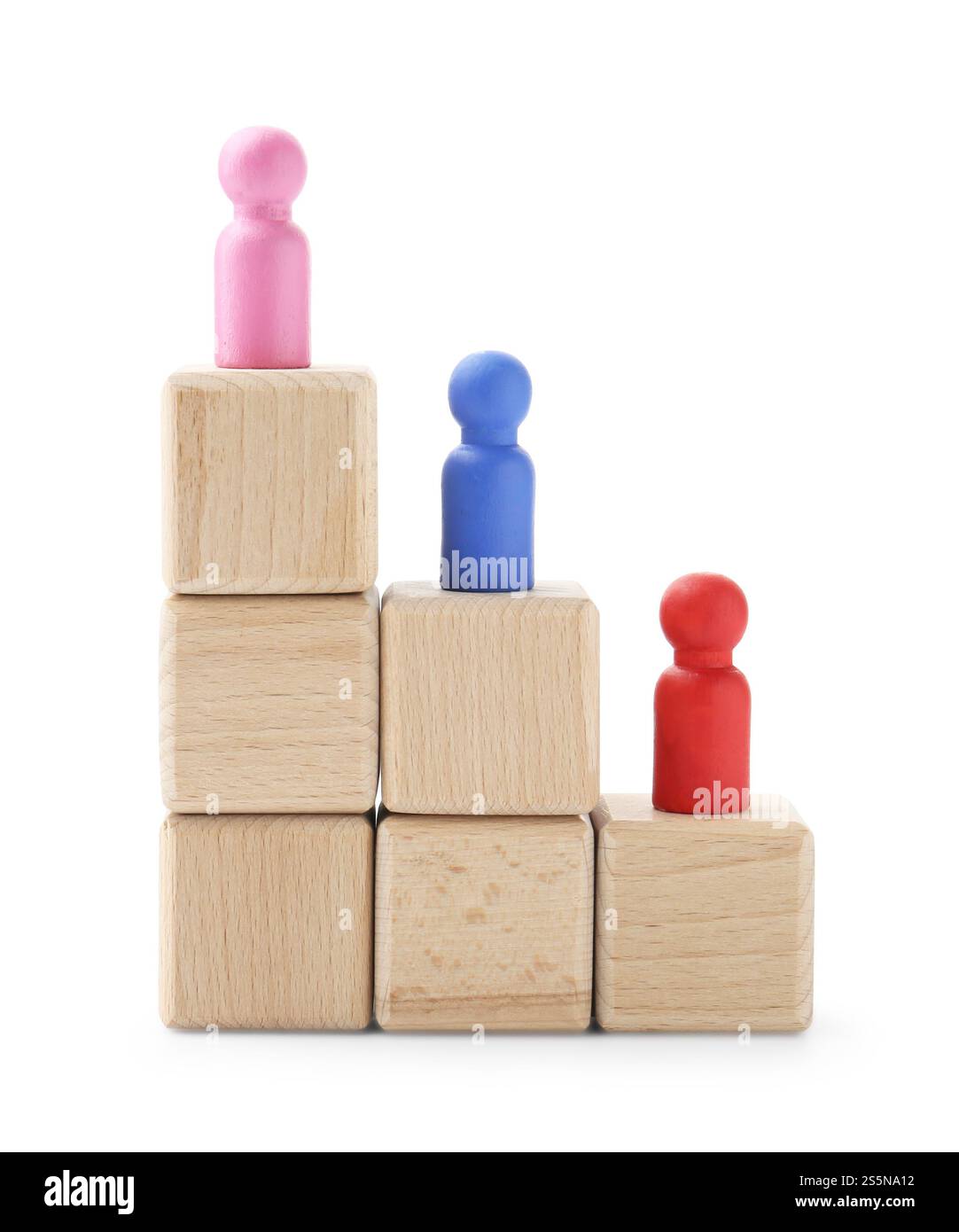 Human figures on wooden blocks, pink one on top against white ...