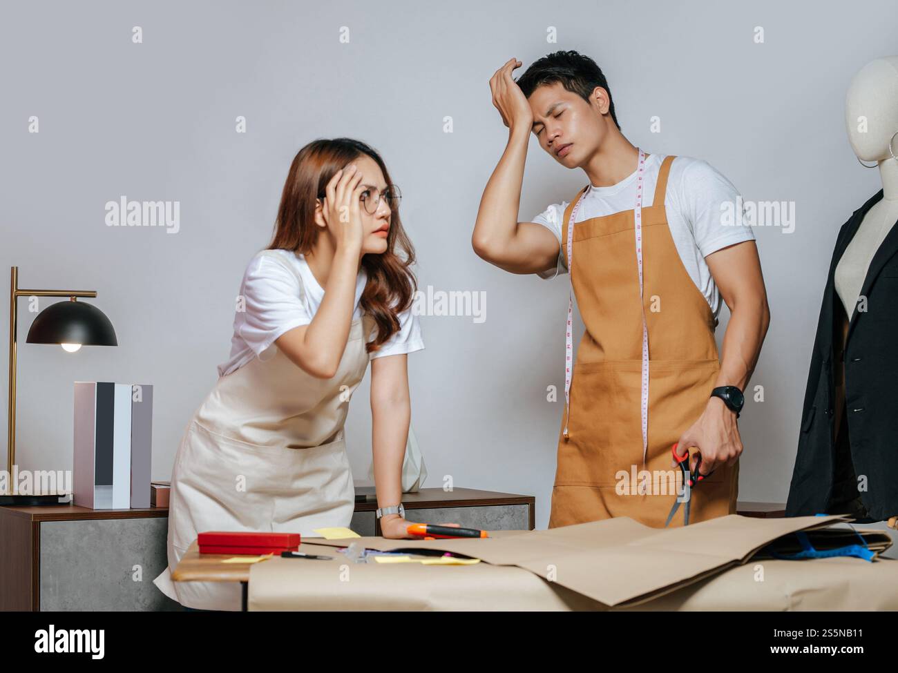 Portrait Young handsome man and pretty woman, Couple fashion designer ...