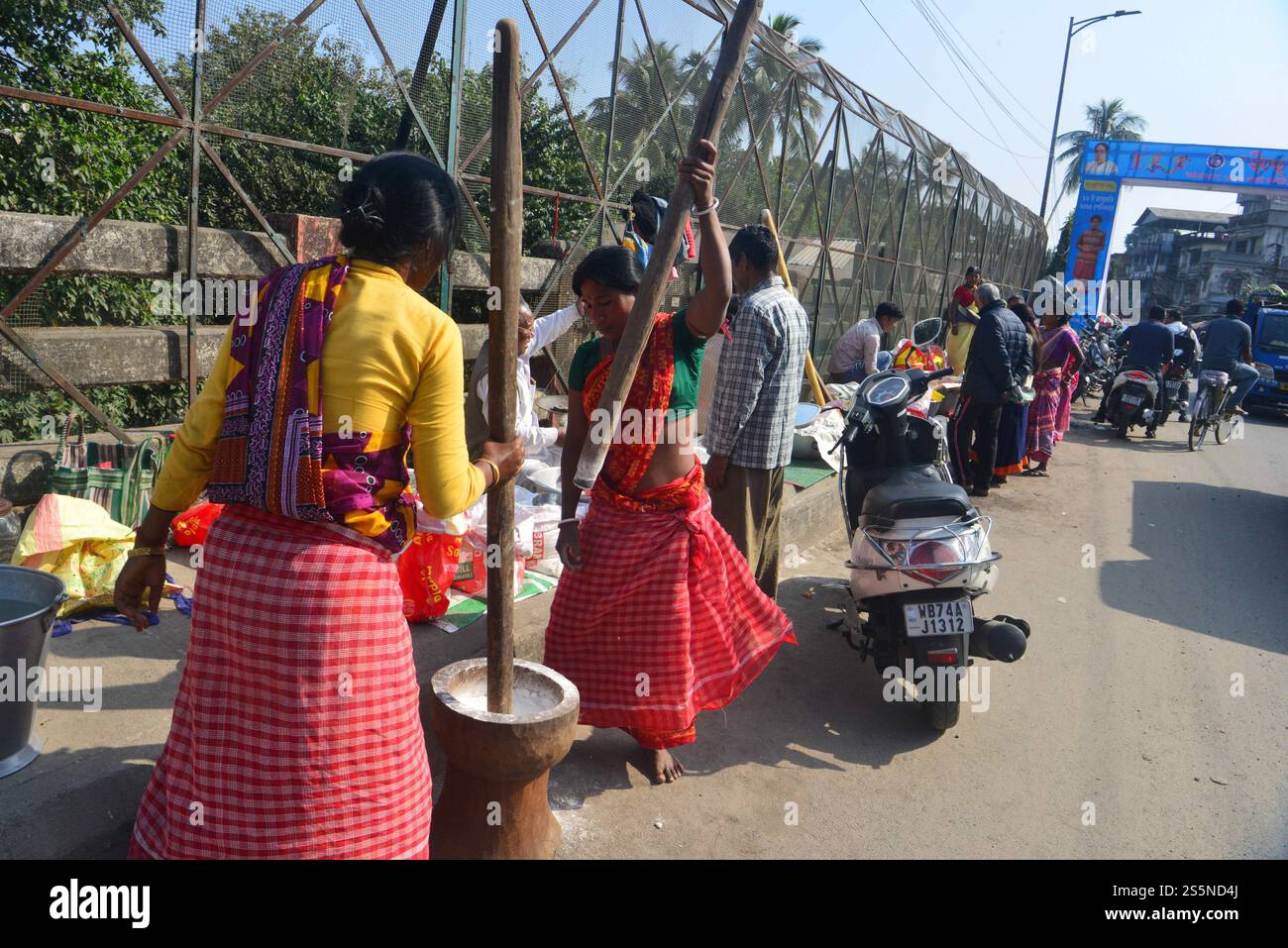 Siliguri, West Bengal, India. 13th Jan, 2025. Women make rice flour ...