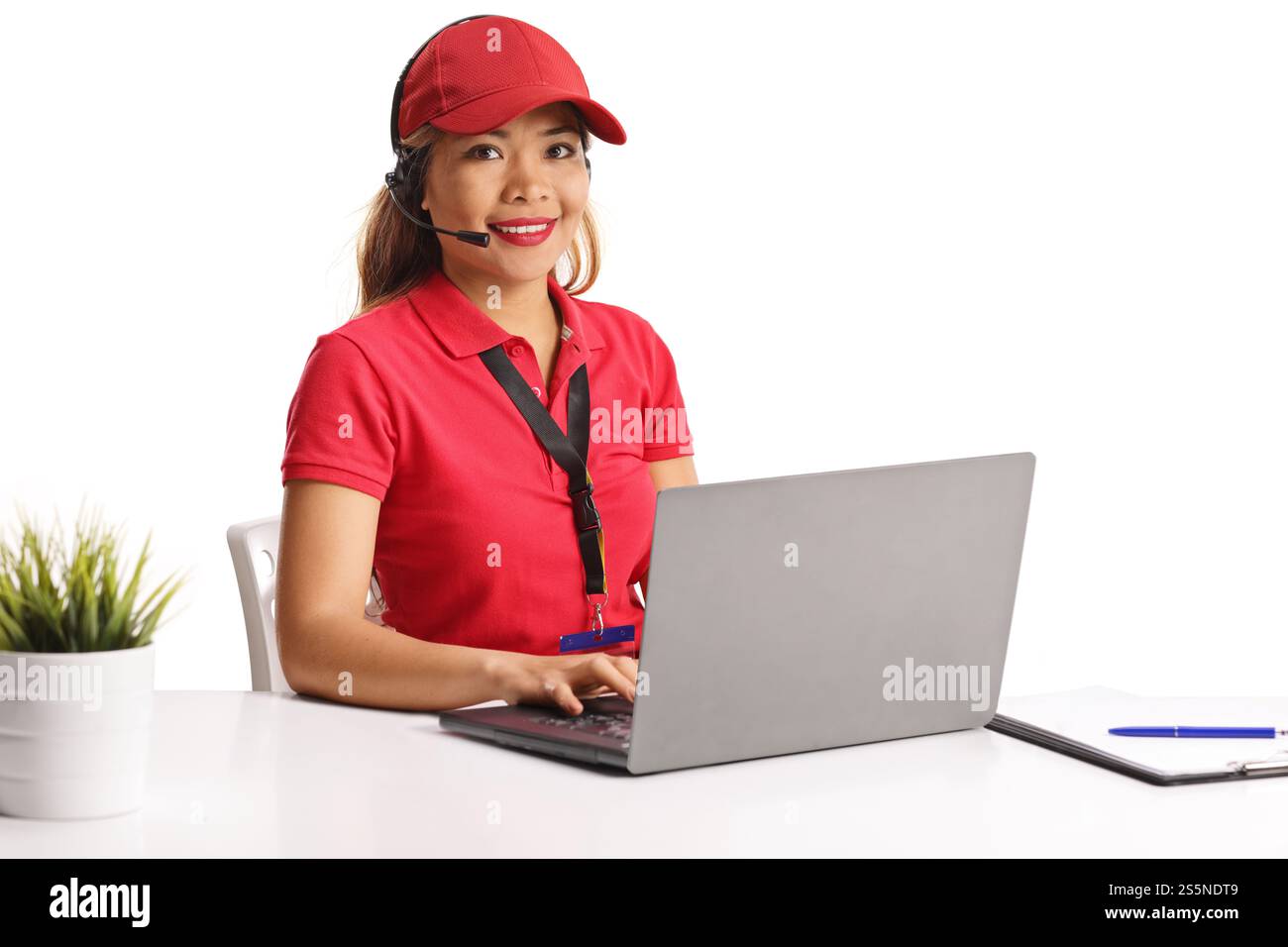Asian female dispatch worker with a laptop computer isolated on white ...